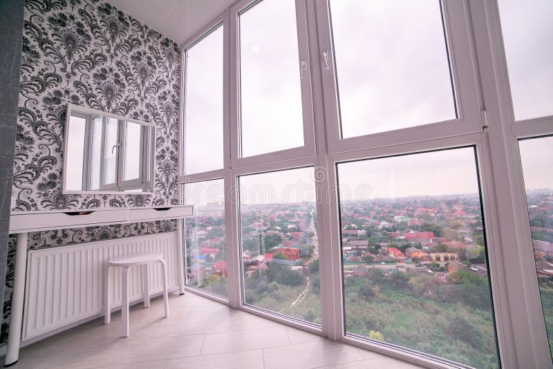 Large Panoramic Window with Views of the City from Above and Bedside ...