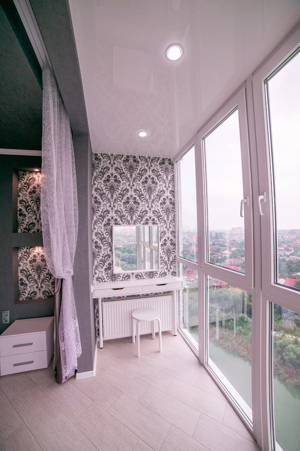 Large Panoramic Window with Views of the City from Above and Bedside ...