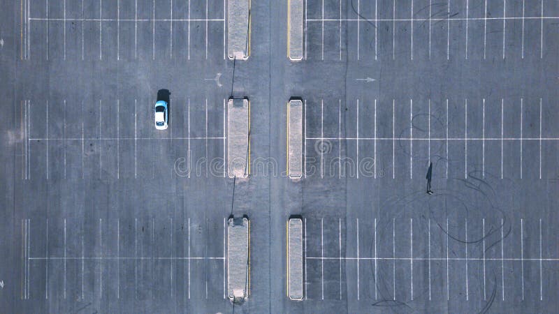 Large Parking Lot with One Car and One Person Stock Image - Image of ...
