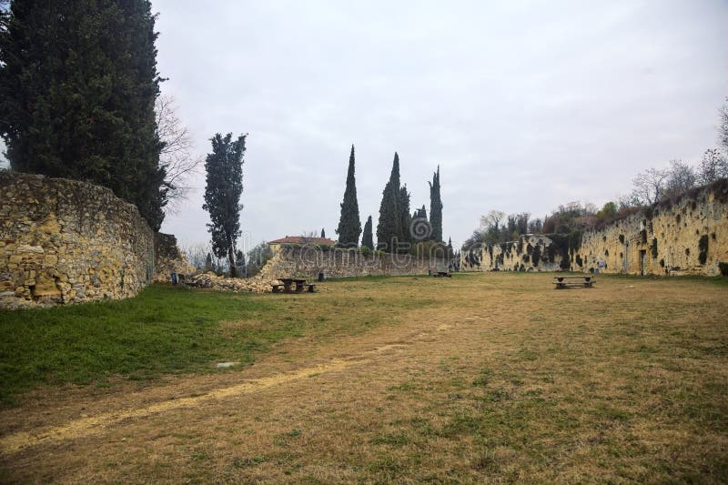 Large Pathway between Stone Walls in a Park on a Cloudy Day in Autumn ...