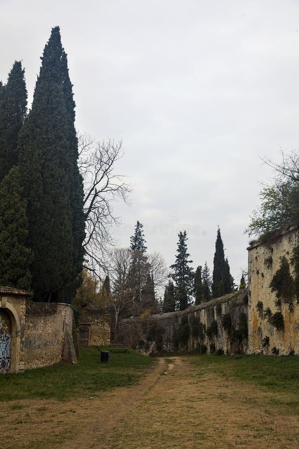 Large Pathway between Stone Walls in a Park on a Cloudy Day in Autumn ...