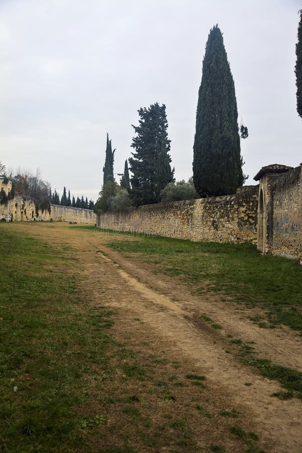 Large Pathway between Stone Walls in a Park on a Cloudy Day in Autumn ...