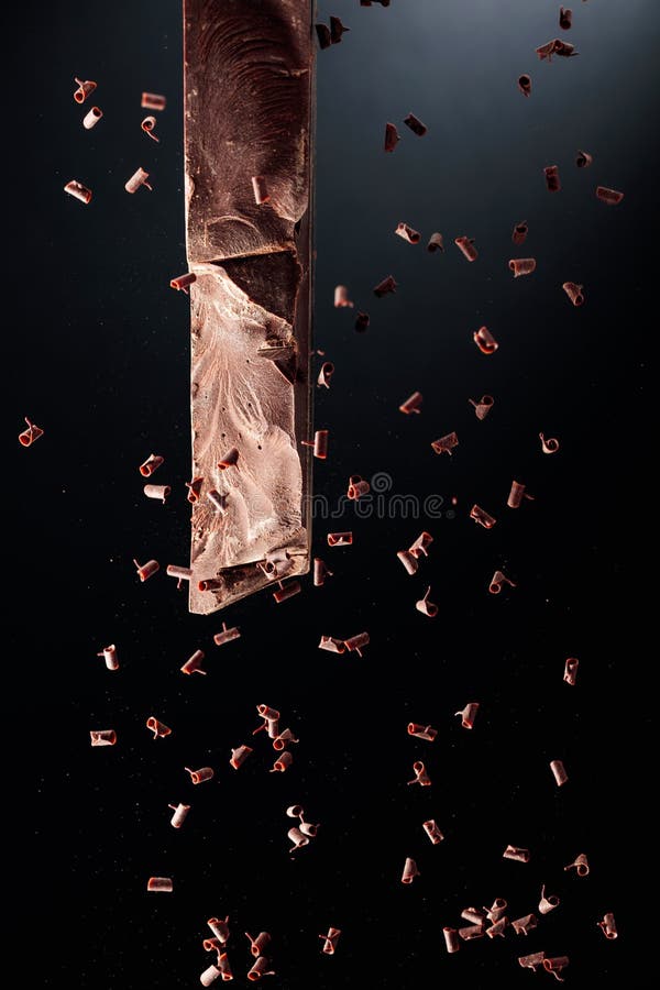 Large Piece of Dark Chocolate and Falling Chocolate Crumbs Stock Image ...