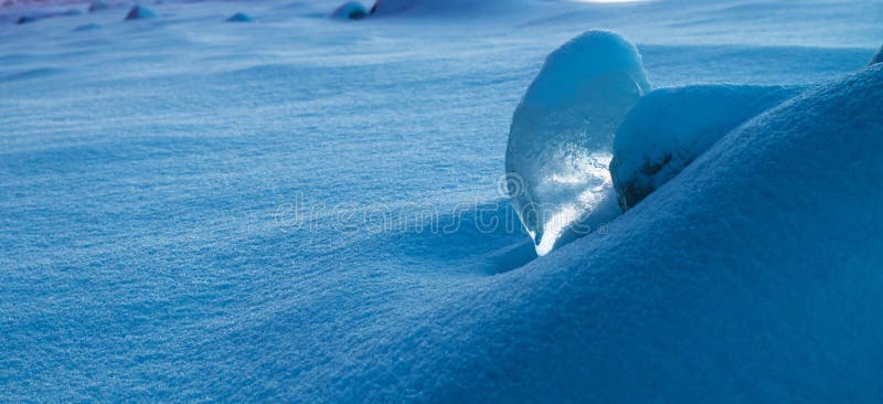 A Large Piece of Ice in the Shape of an Egg Lies Against the Backdrop ...