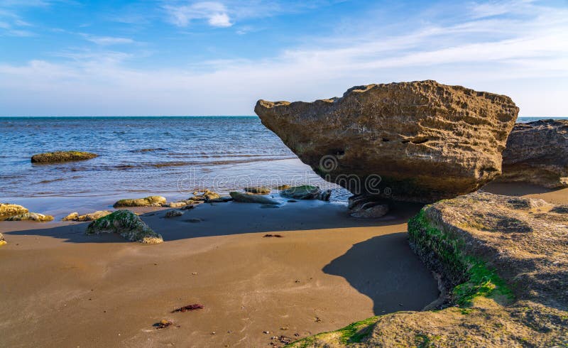 A Large Piece of Rock on the Shore Stock Photo - Image of nature ...