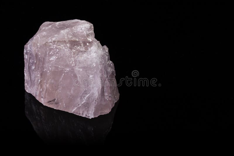 Large Piece of Rose Quartz on a Reflective Black Background Stock Photo ...