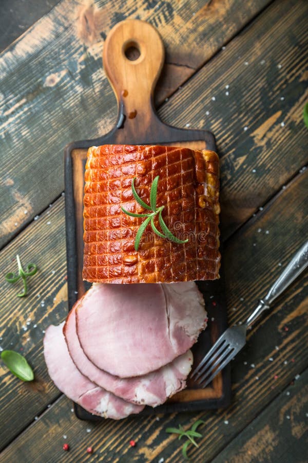 A Large Piece of Smoked Ham. Meat on the Table Stock Photo - Image of ...