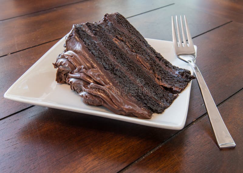 Large Pieces of Chocolate Cake on White Plate with Fork Stock Image ...