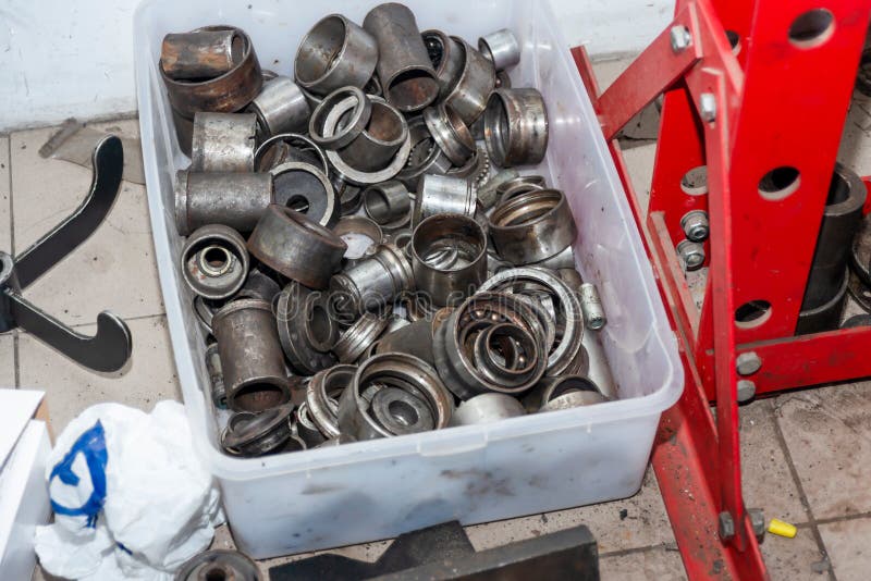 A Large Pile of Bearings are in a Plastic Box on the Floor Stock Photo ...