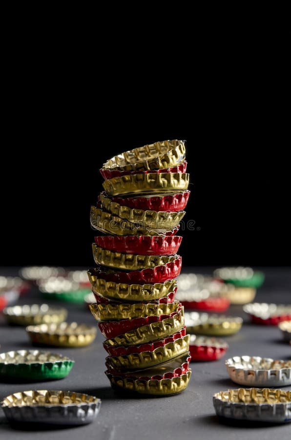 Large Pile of Beer Bottle Caps on Black Dark Background Stock Photo ...