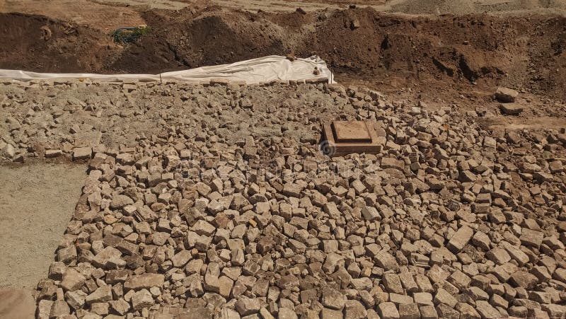 A Large Pile of Broken Stone and Construction Debris Fills the ...