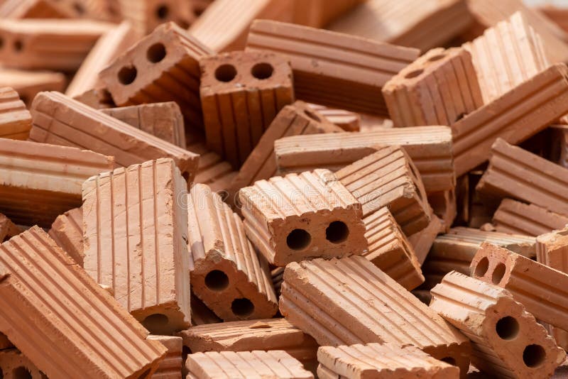 A Large Pile of Orange Bricks is Prepared for the Construction of the ...