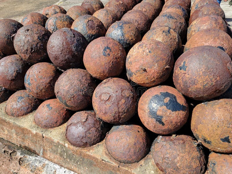 Large Pile or Stack of Rusty Iron Cannon Balls Stock Photo - Image of ...