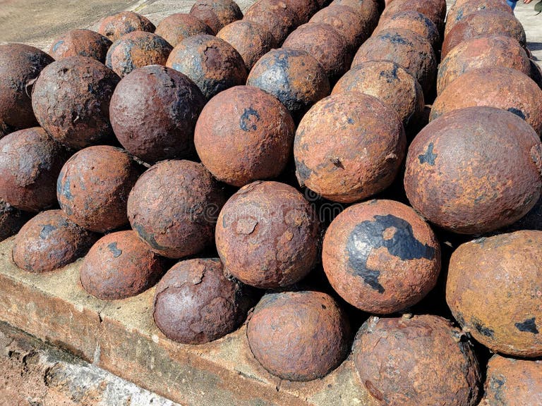 Large Pile or Stack of Rusty Iron Cannon Balls Stock Photo - Image of ...