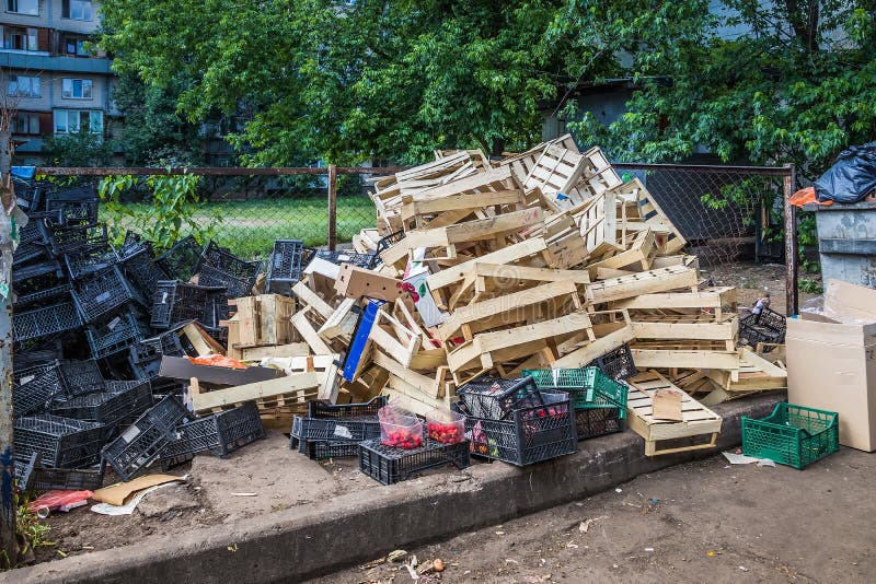 A Large Pile of Wooden Cardboard and Plastic Crates on a Garbage Heap ...