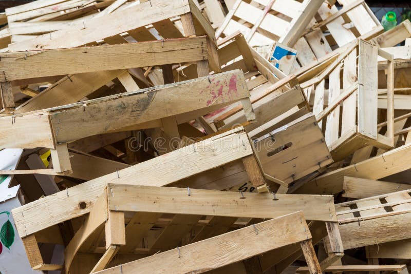 A Large Pile of Wooden Cardboard and Plastic Crates on a Garbage Heap ...