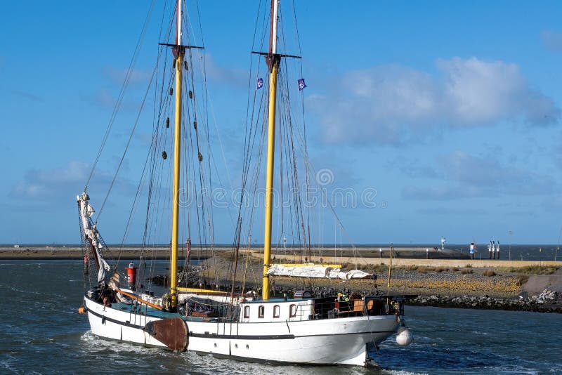 Large Pirate-style Ship Sailing on Blue Water Near a Dock Stock Photo ...