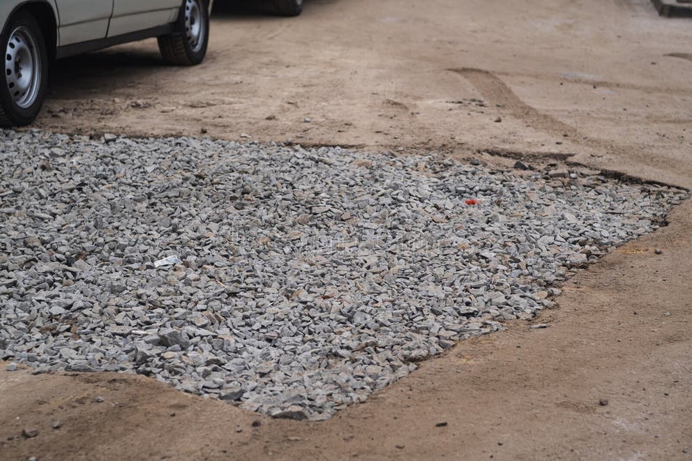 Large Pit in Asphalt Road Covered with Rubble. Concept of Problem Roads ...