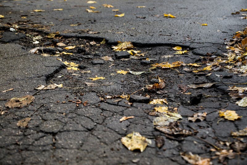 Large Pit with Stones on the Asphalt Road Stock Image - Image of ...