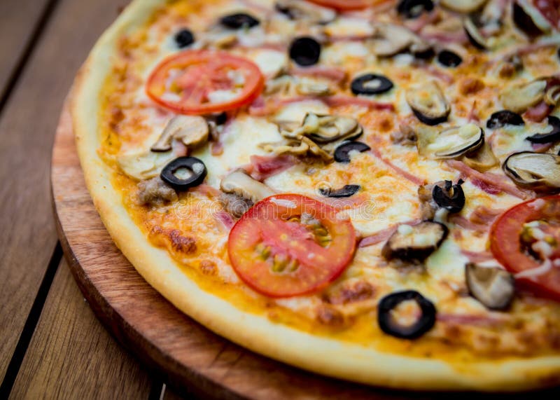 Large Pizza on a Wooden Table. Restaurant. Stock Photo - Image of ...
