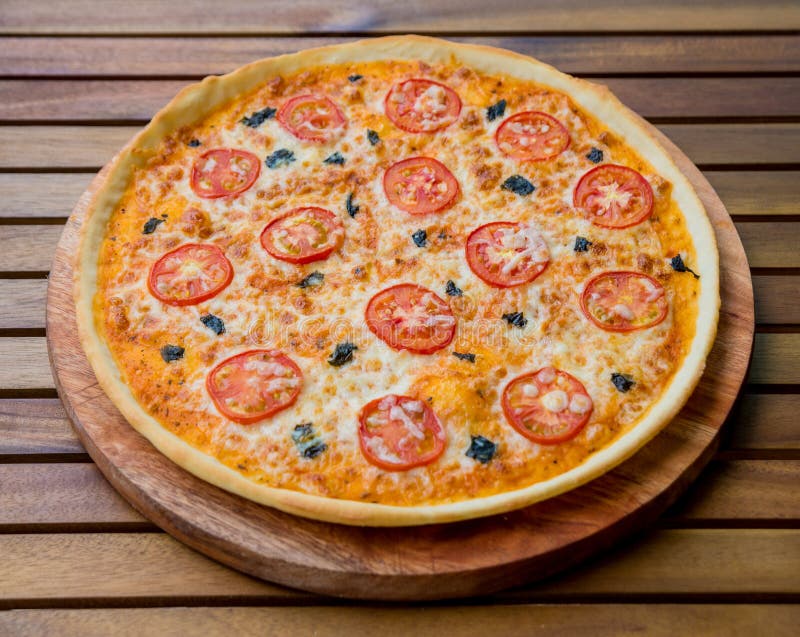 Large Pizza on a Wooden Table. Restaurant. Stock Photo - Image of ...