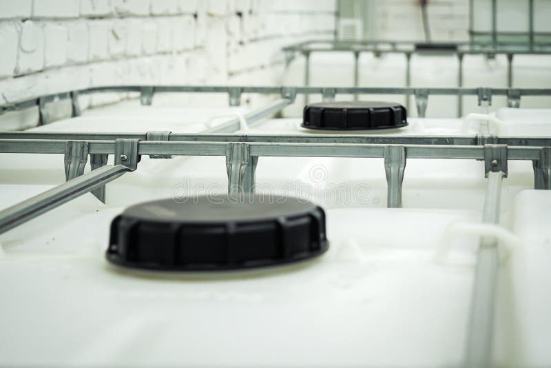 Large Plastic Fuel Containers in Warehouse Stock Image - Image of jerry ...