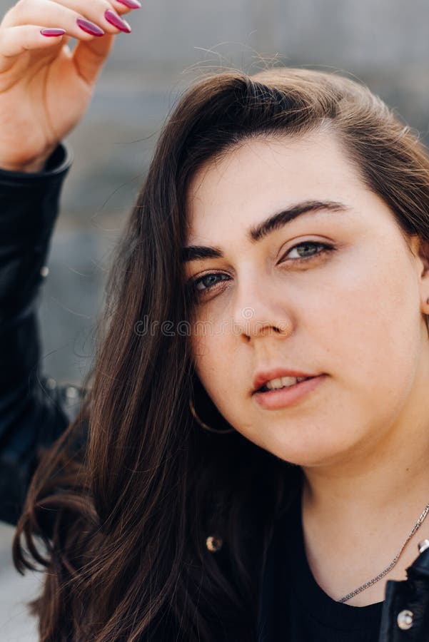 Large Portrait Of A Beautiful Woman In A Leather Jacket Stock Image