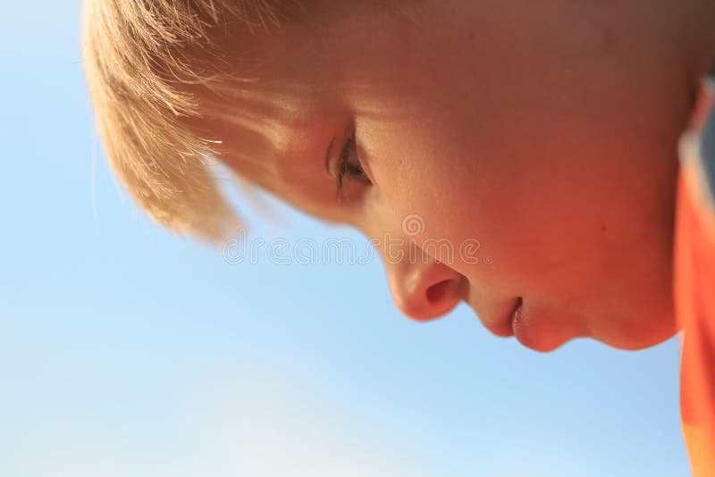 Large Portrait of a Child in the Rays of the Setting Sun Against the ...