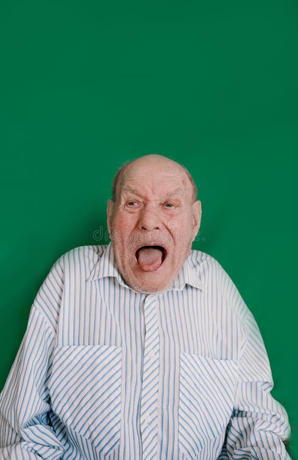 A Large Portrait of a Crazy Old Man on an Isolated Green Background ...