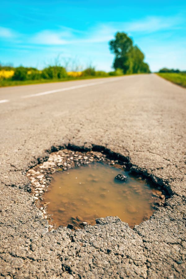 Pothole on Countryside Road Stock Image - Image of rocks, textures ...