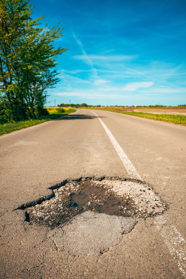 Pothole on Countryside Road Stock Image - Image of rocks, textures ...