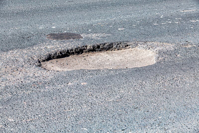 Large Pothole an Example of Poor Road Maintenance Stock Photo - Image ...