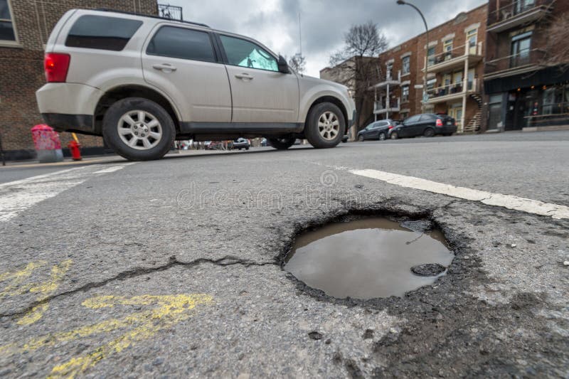 Large Potholes in Montreal Street, Canada Editorial Stock Image - Image ...