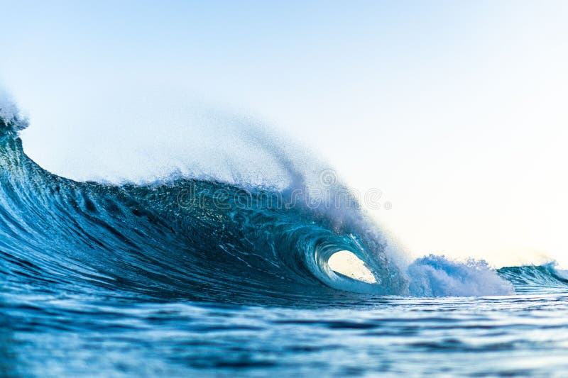 Large, Powerful Wave Crashing Against the Shoreline of a Beach Stock ...