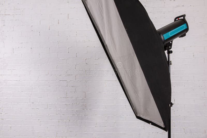 Large Professional Photo Studio Lamps on a White Brick Wall Stock Photo ...