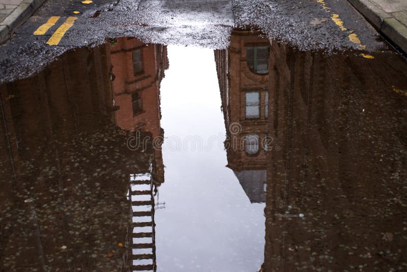 A Large Puddle on the Road with the Reflection Manchester Stock Photo ...