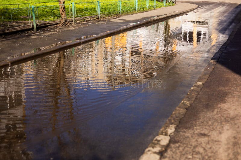 Large Puddle between the Sidewalks Stock Photo - Image of space ...