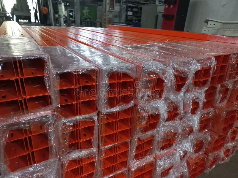 Large Quantity of Orange Support Beams for Commercial Pallet Racks in ...