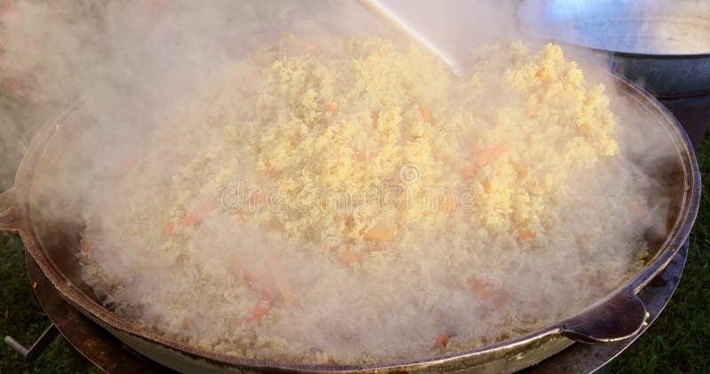Rice Preparation. Large Pan Cooking Outdoors. Stock Footage - Video of ...