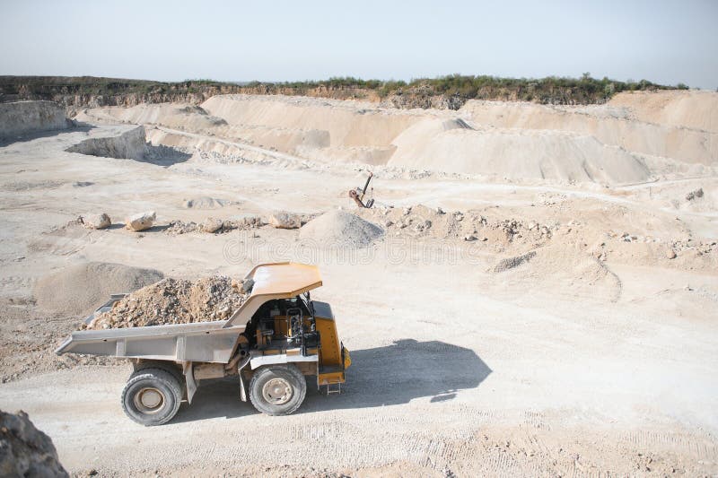 Large Quarry Dump Truck. Big Yellow Mining Truck at Work Site. Quarry ...