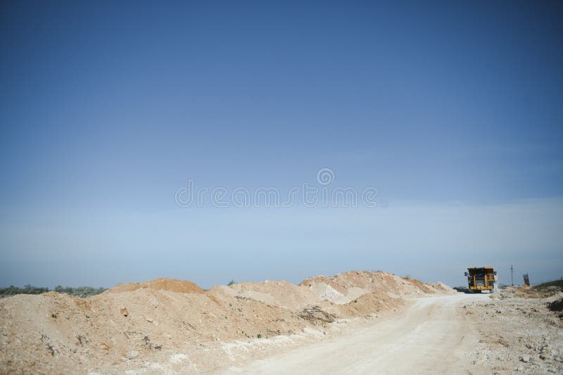 Large Quarry Dump Truck. Big Yellow Mining Truck at Work Site. Quarry ...