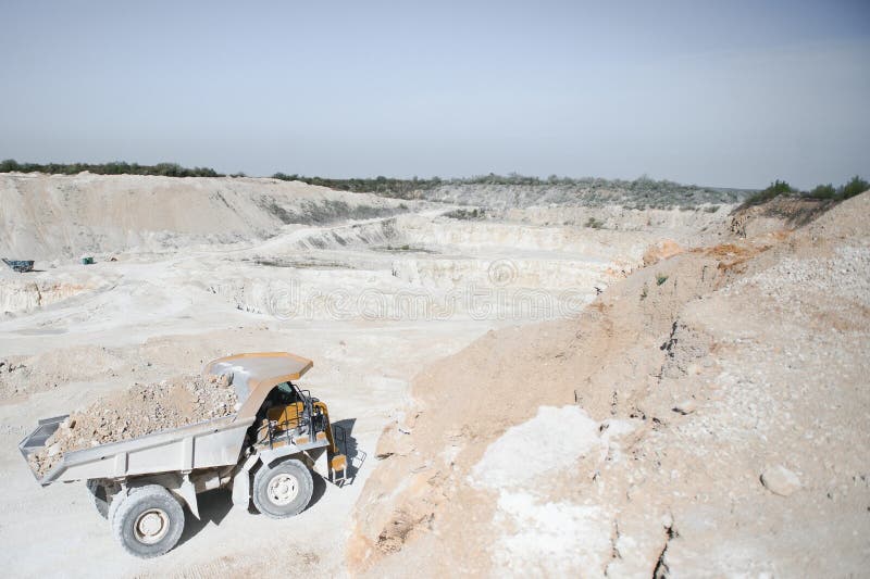 Large Quarry Dump Truck. Big Yellow Mining Truck at Work Site. Quarry ...