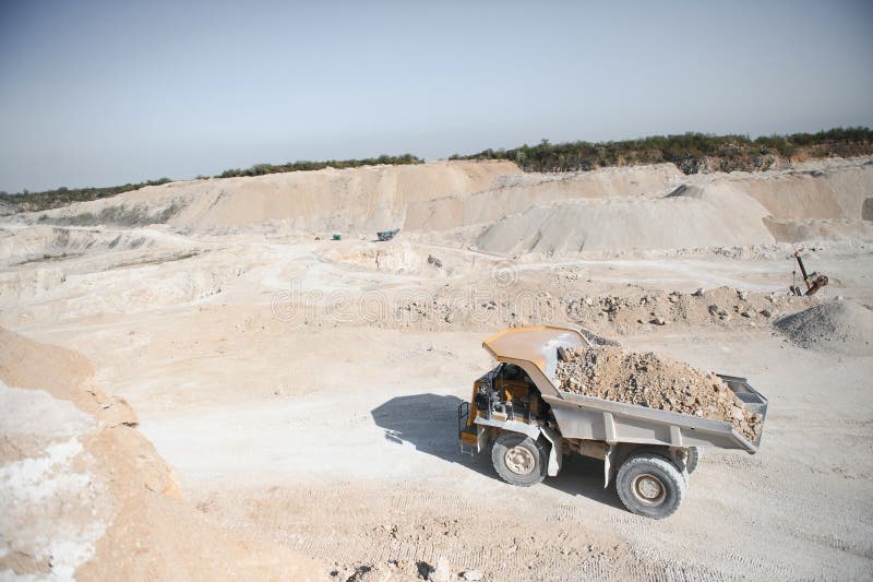 Large Quarry Dump Truck. Big Yellow Mining Truck at Work Site. Quarry ...