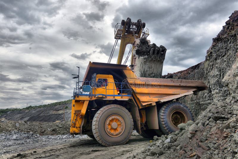 Large Quarry Dump Truck. Loading the Rock in the Dumper Stock Photo ...
