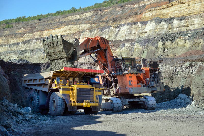 Large Quarry Dump Truck. Loading the Rock in the Dumper Stock Photo ...