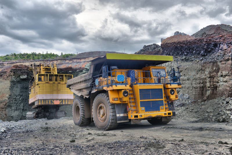 Large Quarry Dump Truck. Loading the Rock in the Dumper Stock Photo ...