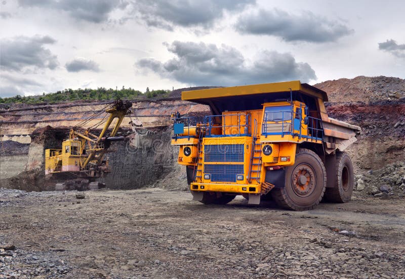 Large Quarry Dump Truck. Loading the Rock in the Dumper Stock Photo ...