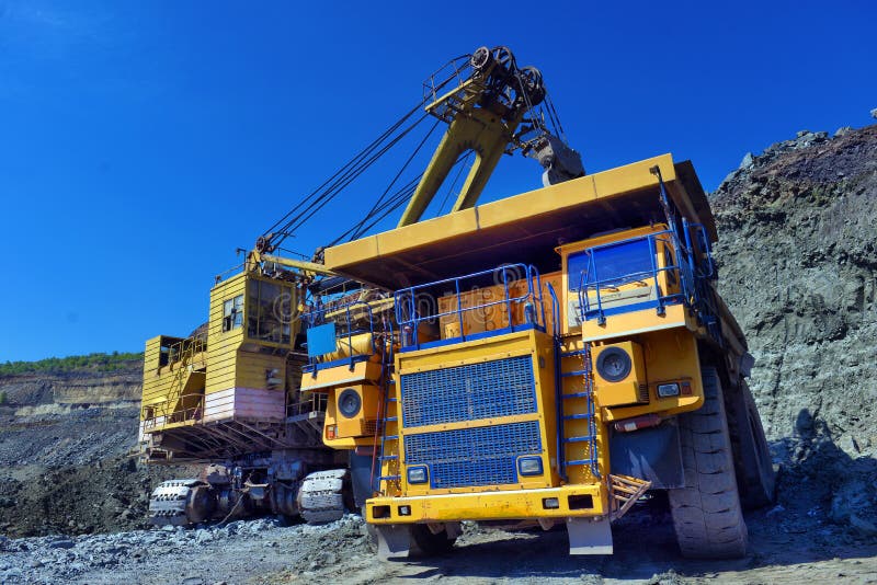 Large Quarry Dump Truck. Loading The Rock In The Dumper. Loading Stock ...
