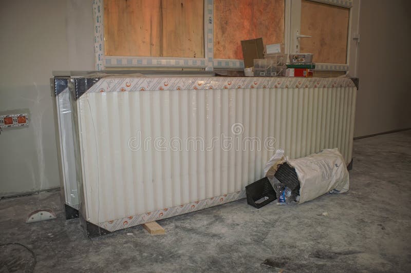 Radiator in Unfinished Room with Construction Materials Editorial Stock ...