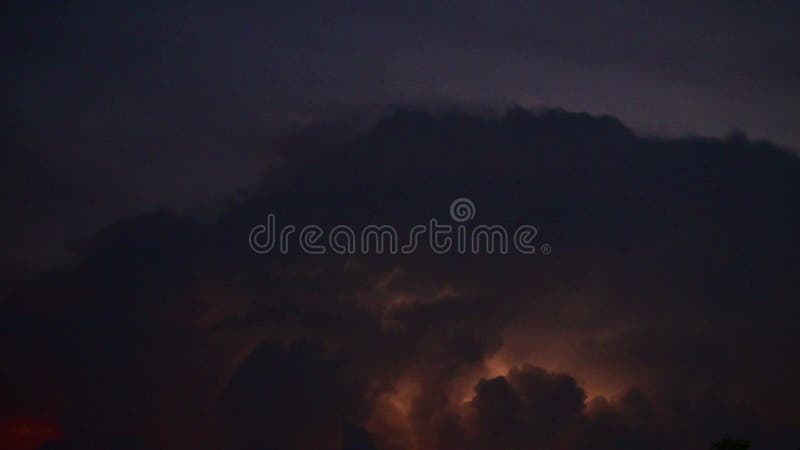 A Large Rain Cloud with Thunderstorms with Lightning a Large Rain Cloud ...